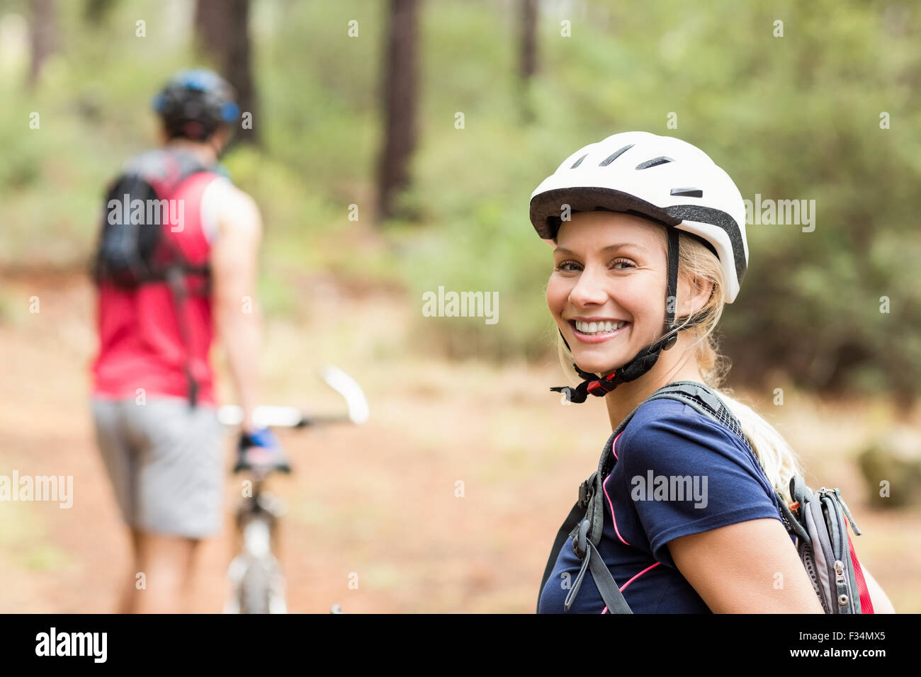 Pretty biker looking at camera Stock Photo - Alamy