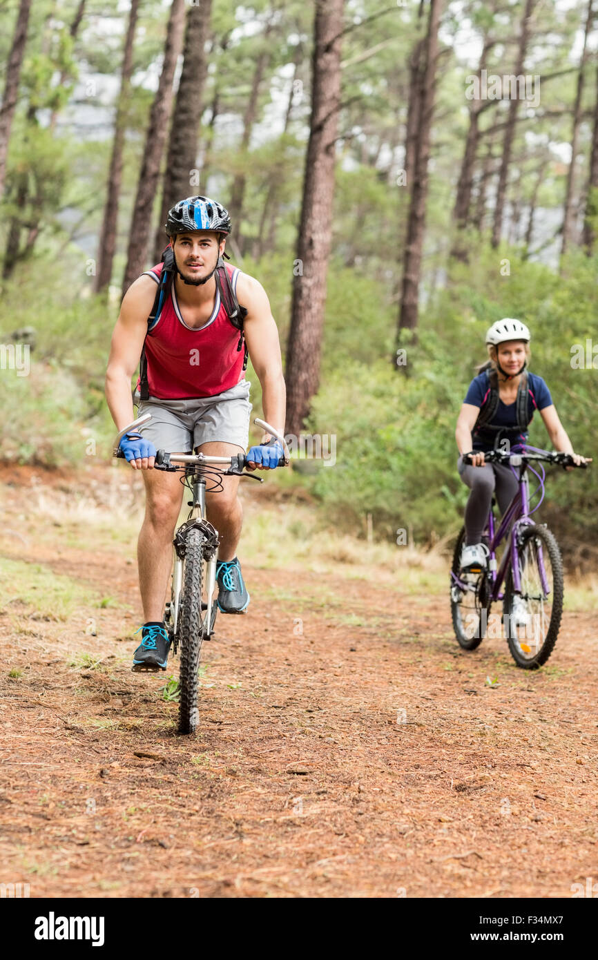Pretty biker couple biking Stock Photo - Alamy