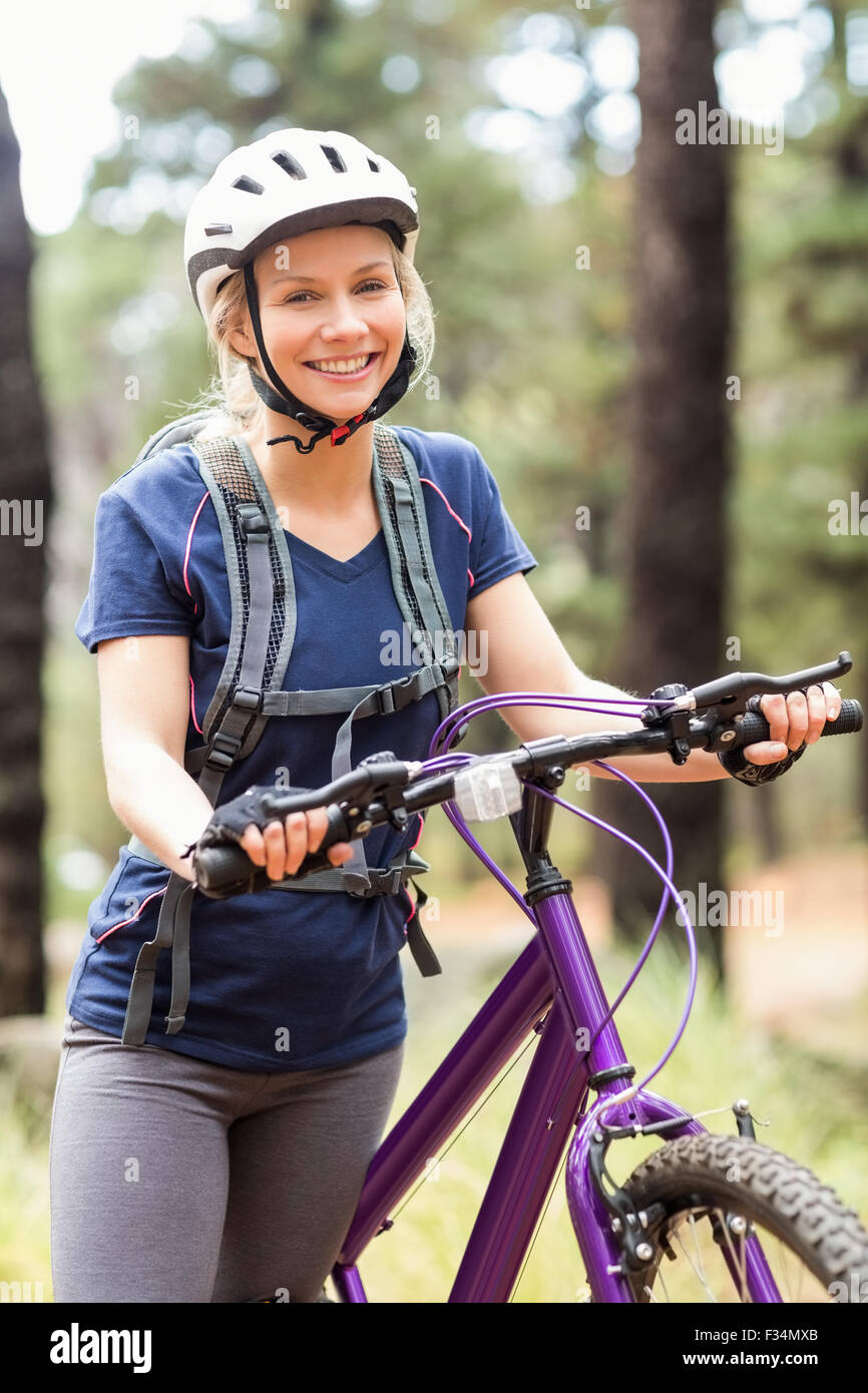 Young pretty happy biker looking at camera Stock Photo - Alamy