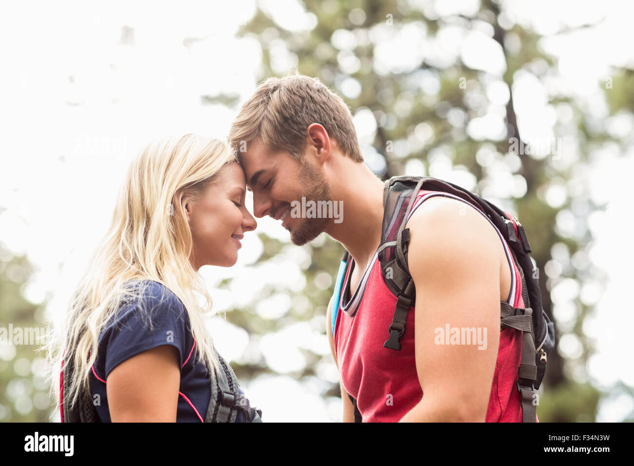 Happy young couple touching foreheads Stock Photo - Alamy