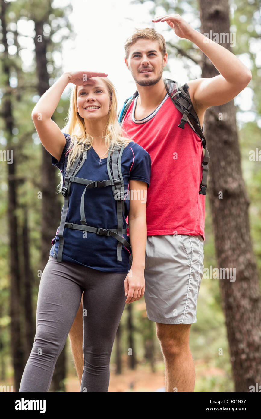 Young happy hiker couple looking away Stock Photo - Alamy