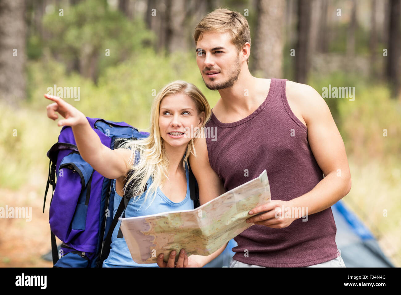 Young happy joggers looking at something in the distance Stock Photo ...