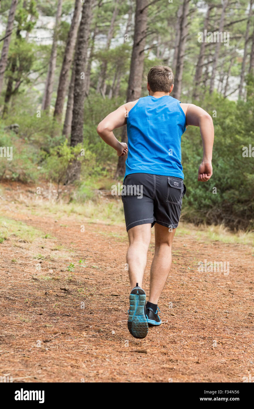 Young happy jogger running Stock Photo - Alamy