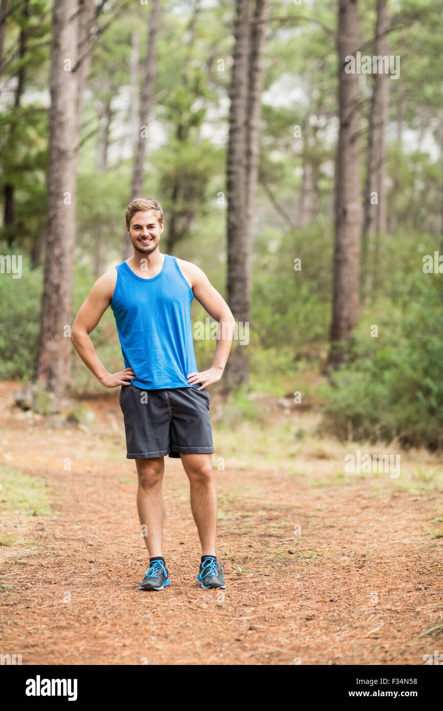 Young happy jogger standing Stock Photo - Alamy
