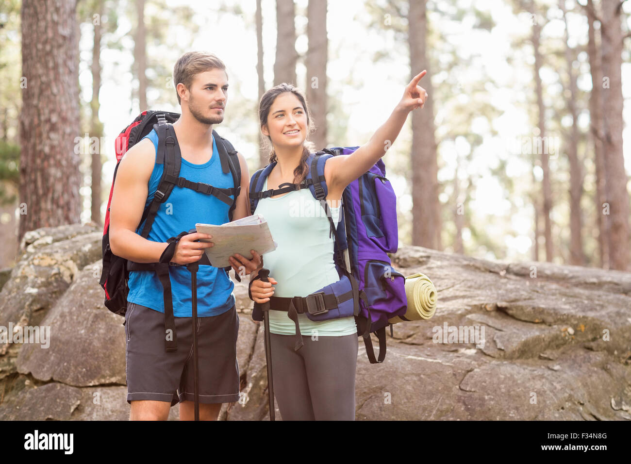 Young happy joggers looking at something in the distance Stock Photo ...