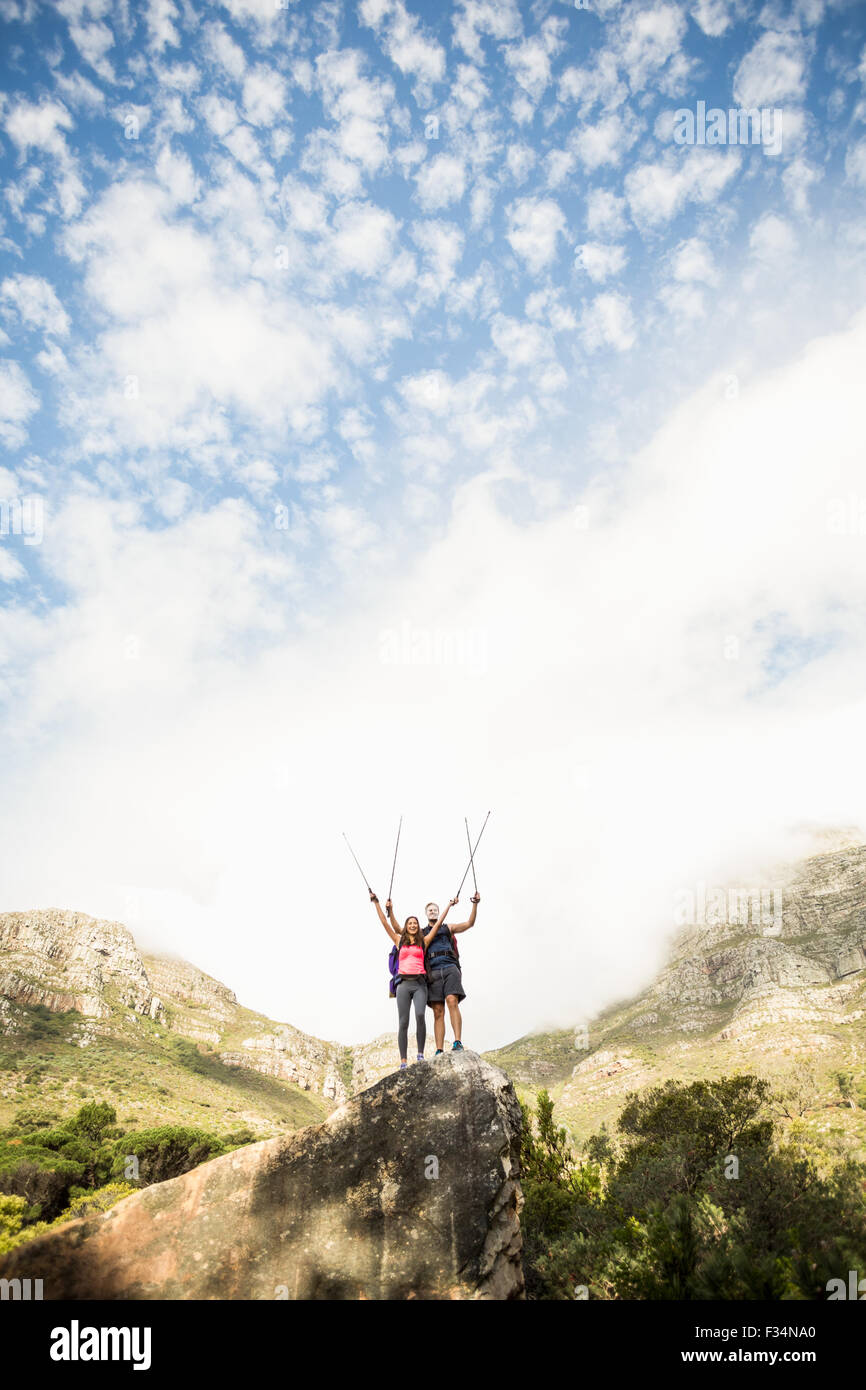Young happy joggers standing on rock cheering Stock Photo - Alamy