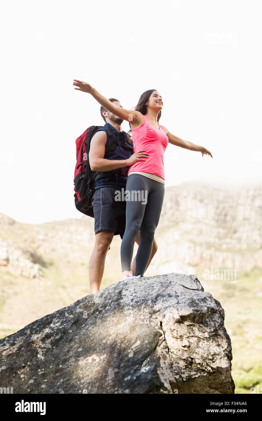 Young happy joggers posing on rock Stock Photo - Alamy