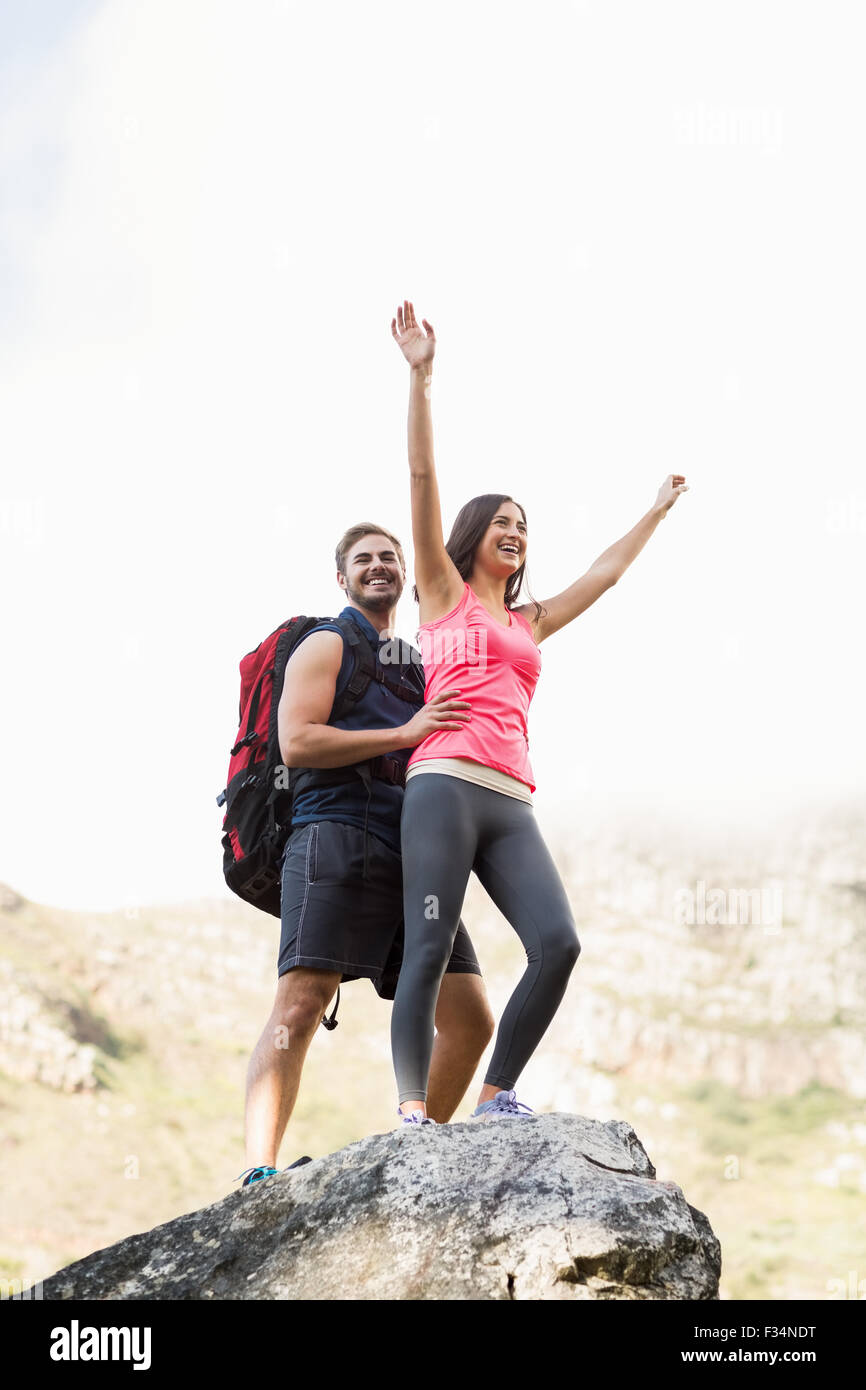 Young happy joggers posing on rock Stock Photo - Alamy