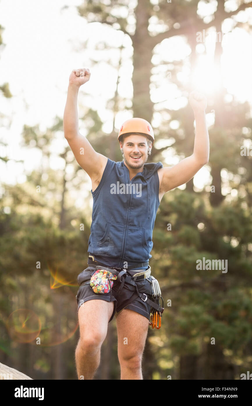 Handsome young hiker looking at camera and cheering Stock Photo - Alamy