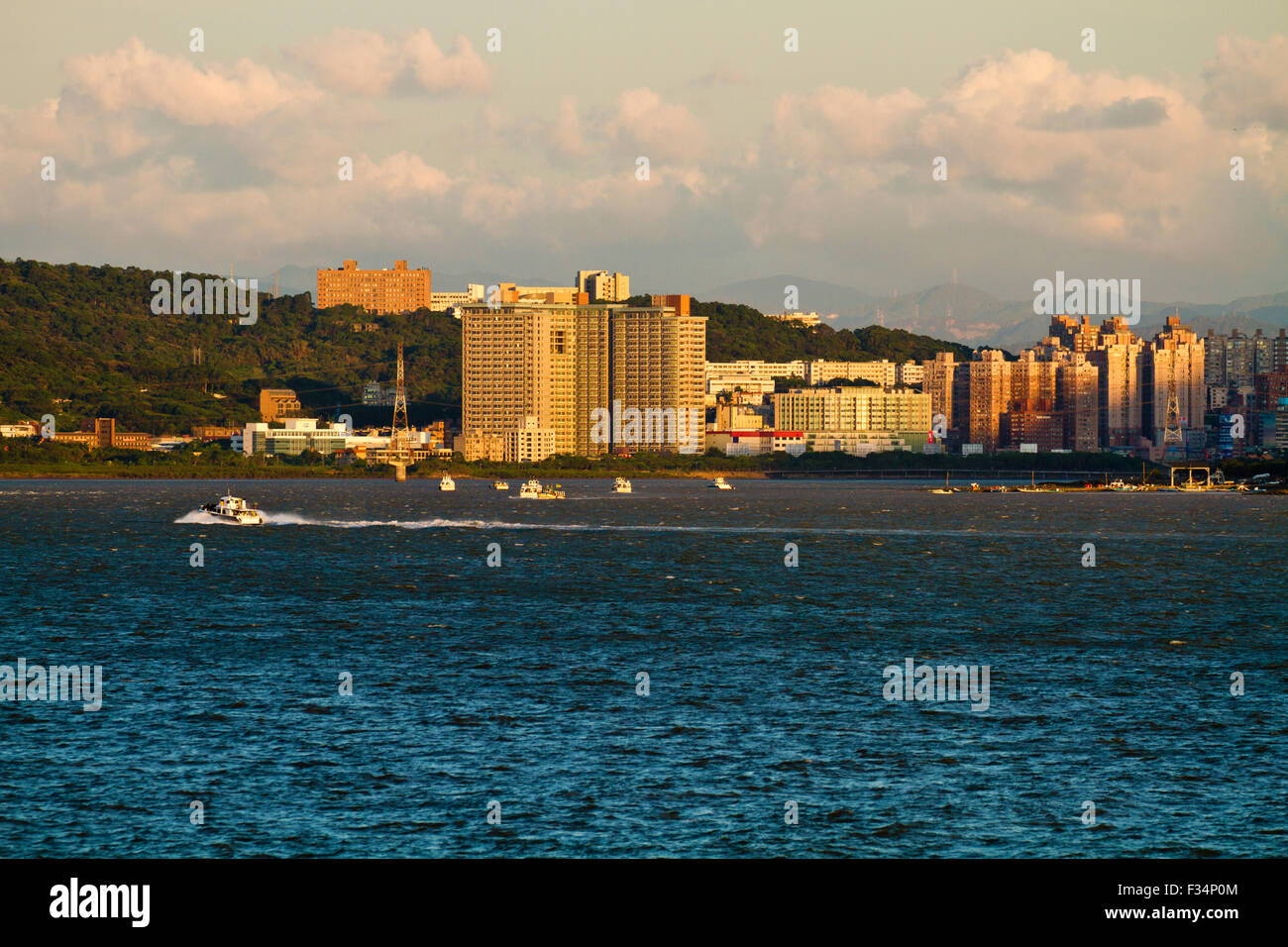 yacht running over the city landscape on Dansui River Stock Photo - Alamy