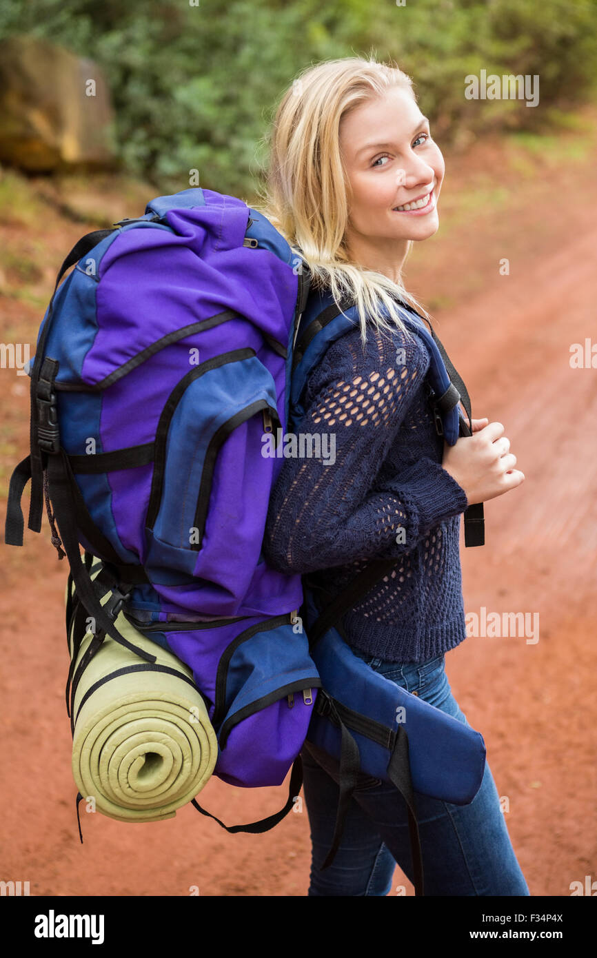 Smiling female hiker looking at the camera Stock Photo - Alamy