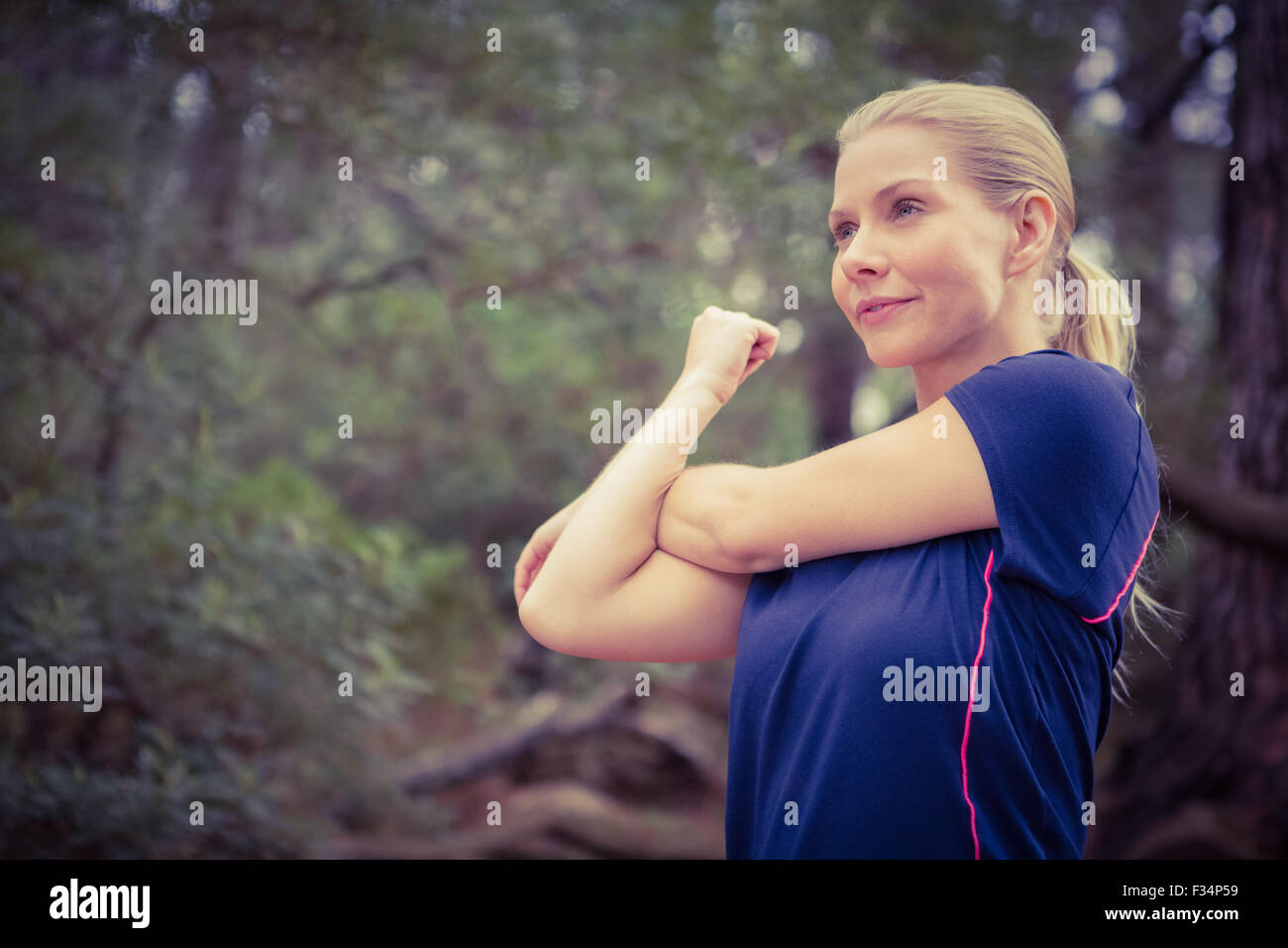 Athletic blonde stretching arms Stock Photo - Alamy
