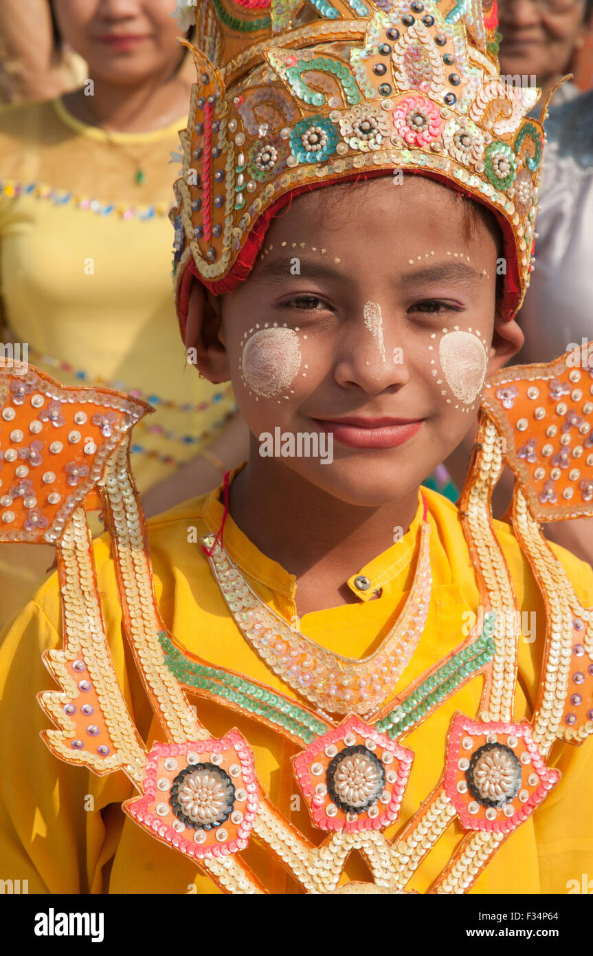 Portrait of a young child in traditional costume at Shwedagon Paya ...