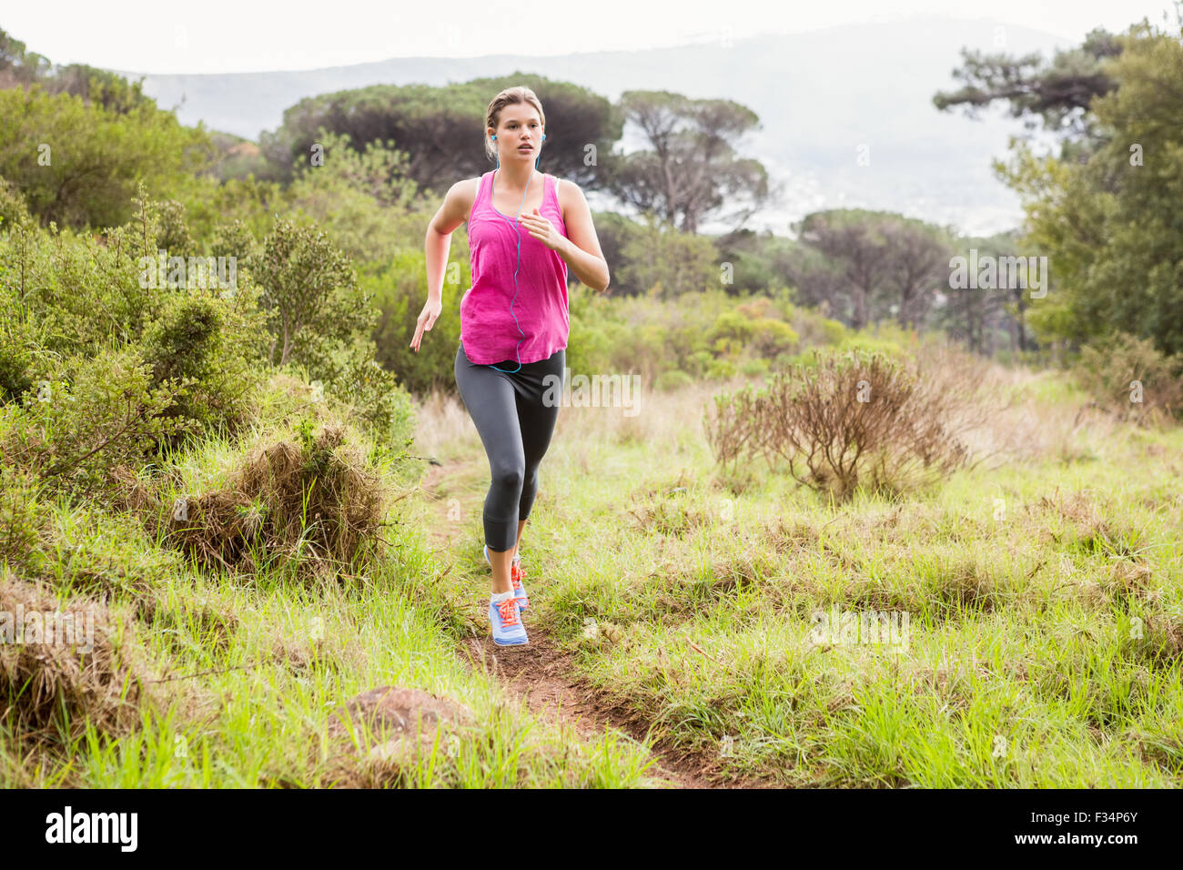 Pretty blonde athlete jogging Stock Photo - Alamy