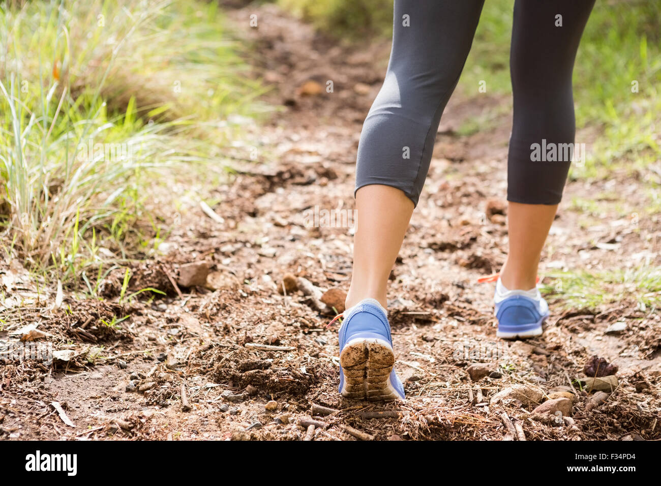 Close up view of athletes legs on trail Stock Photo - Alamy