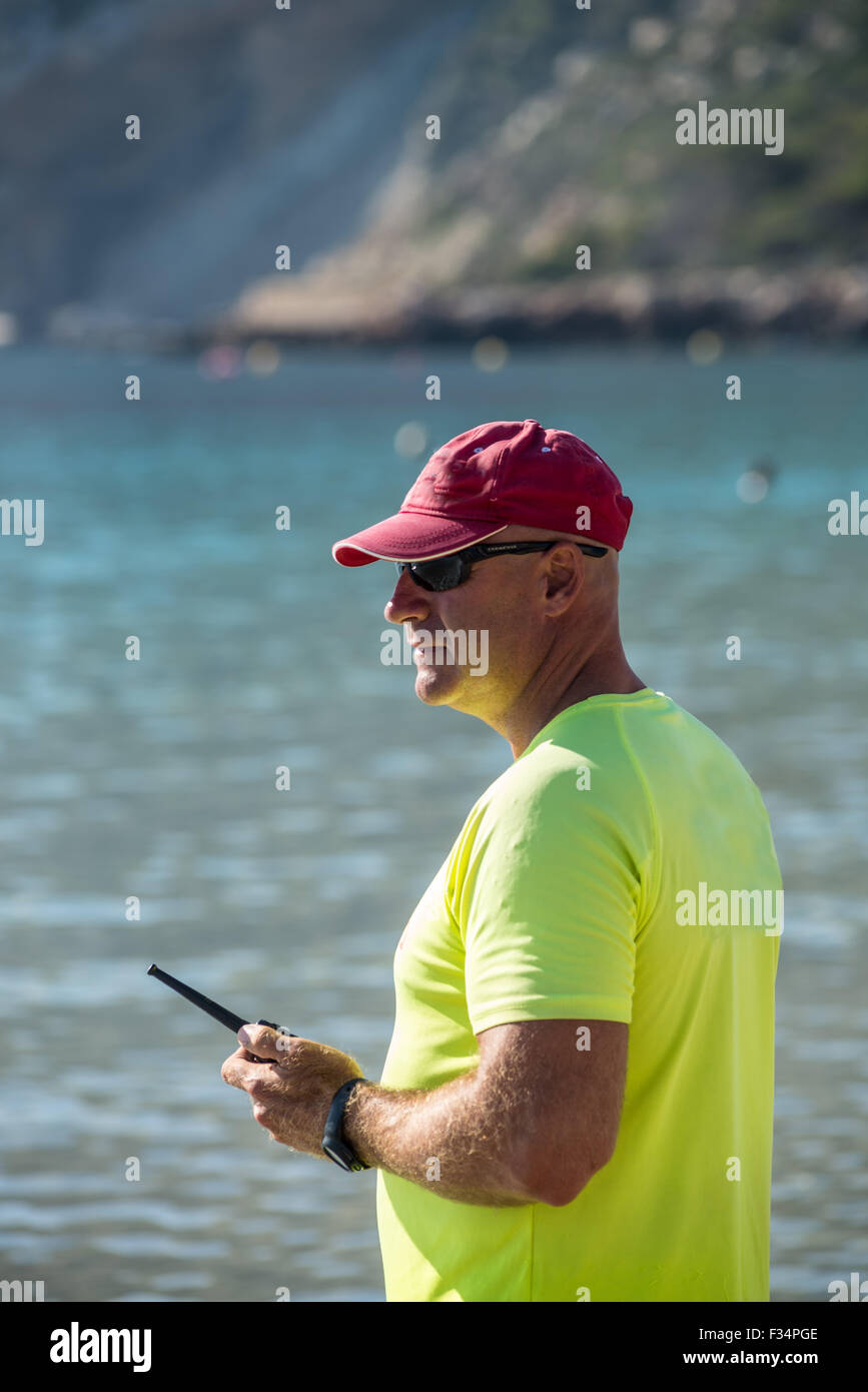 Lifeguard standing on the shore of a beach resort Stock Photo - Alamy