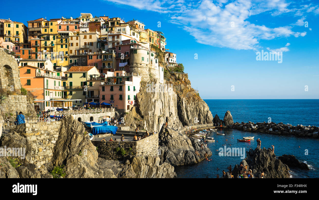 Cliffside view of Manarola village and harbor in Italy's Cinque Terre ...