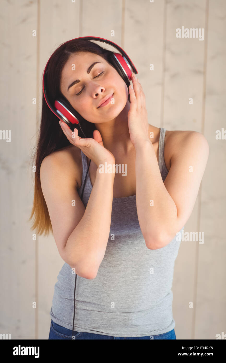 Pretty hipster listening to music Stock Photo - Alamy