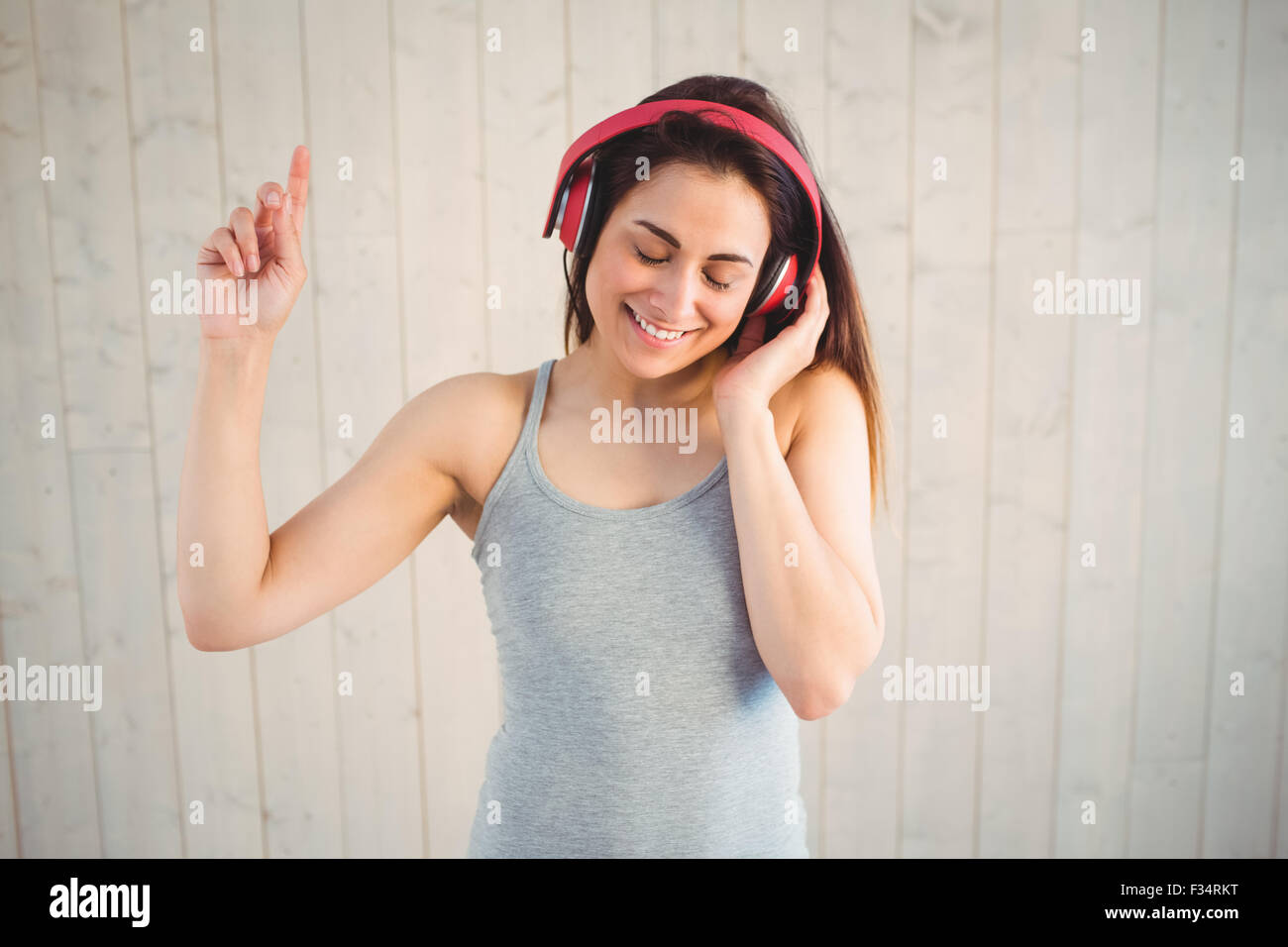 Pretty hipster listening to music Stock Photo - Alamy