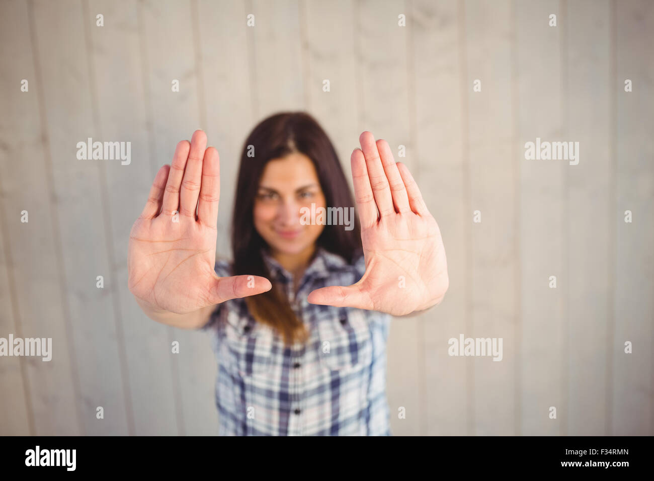 Pretty hipster holding hands up Stock Photo - Alamy