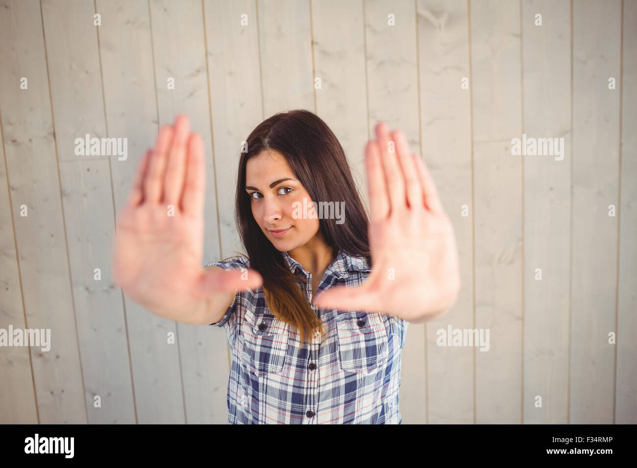 Pretty hipster holding hands up Stock Photo - Alamy