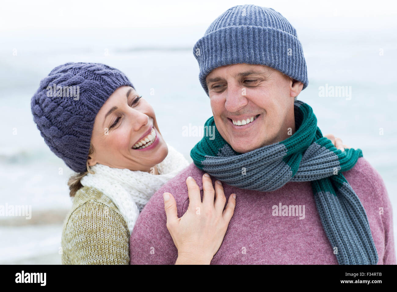 Smiling happy couple hugging each other Stock Photo - Alamy
