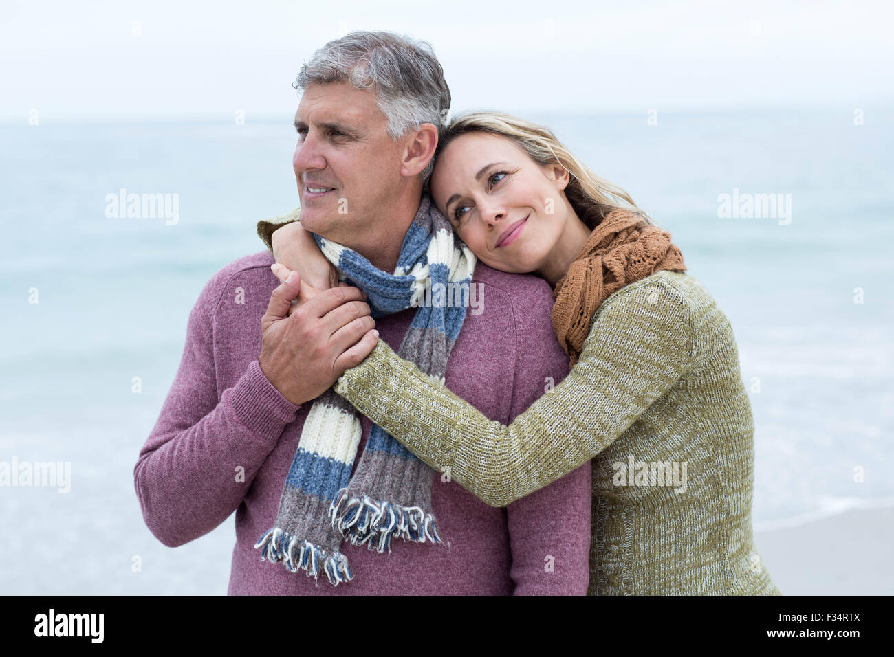 Smiling happy couple hugging each other Stock Photo - Alamy
