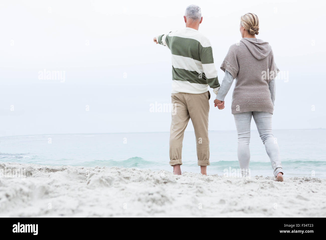 Woman holding a mans hand Stock Photo - Alamy