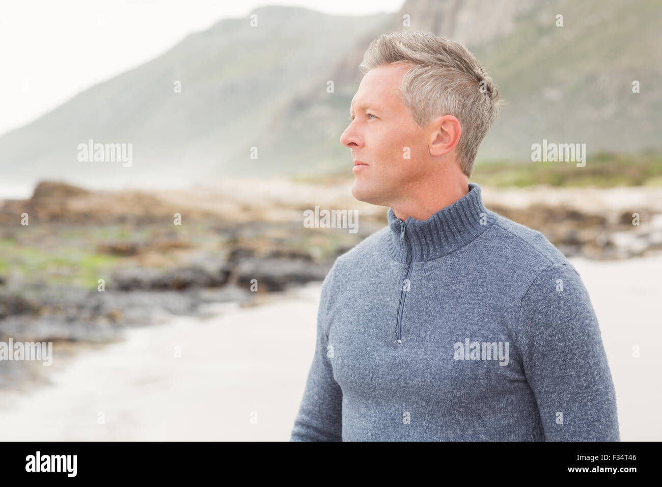 Man looking out past the shore Stock Photo - Alamy
