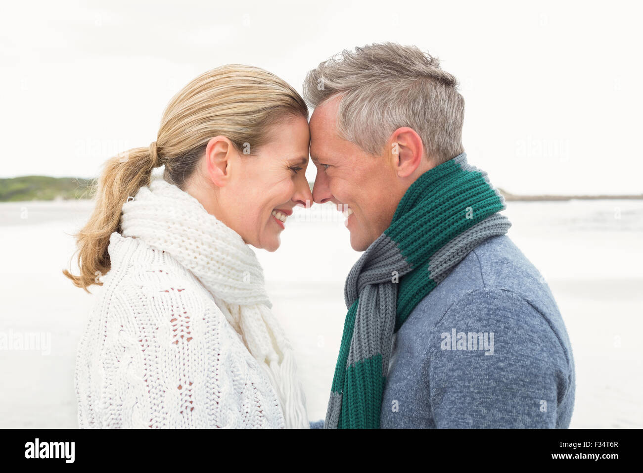 Cute couple standing and holding each other Stock Photo - Alamy