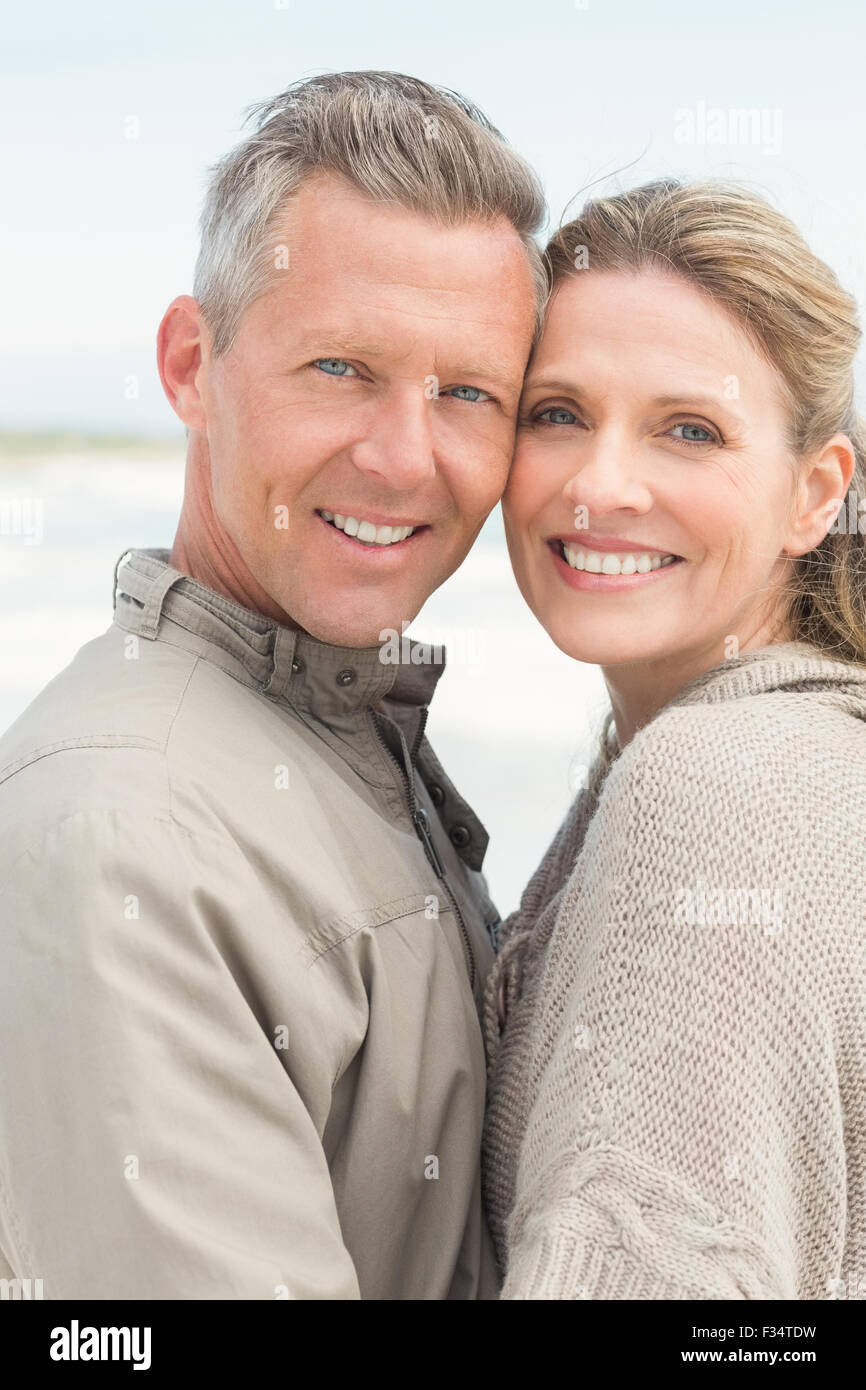 Happy couple holding each other Stock Photo - Alamy