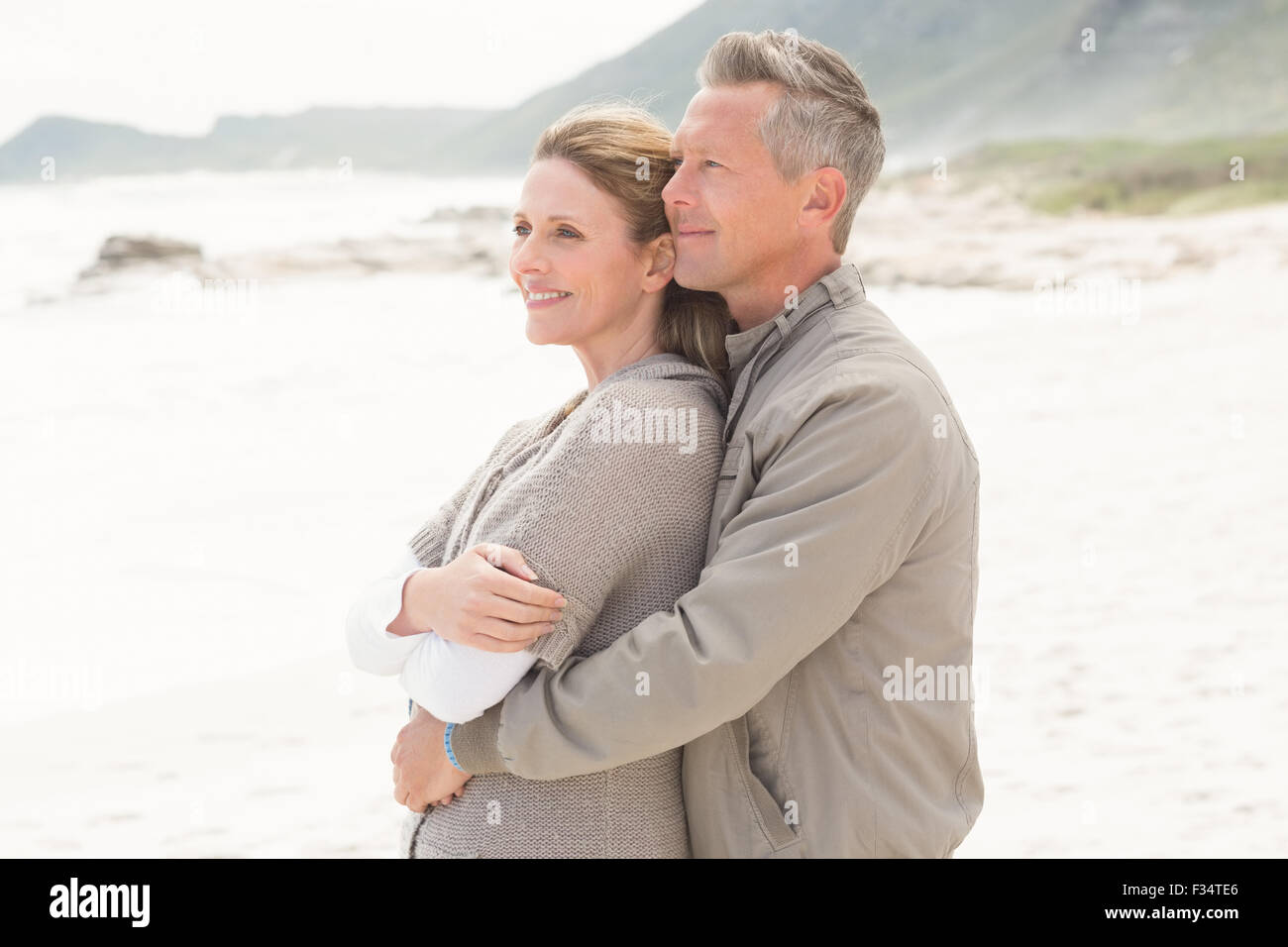 Smiling man holding his partner Stock Photo - Alamy