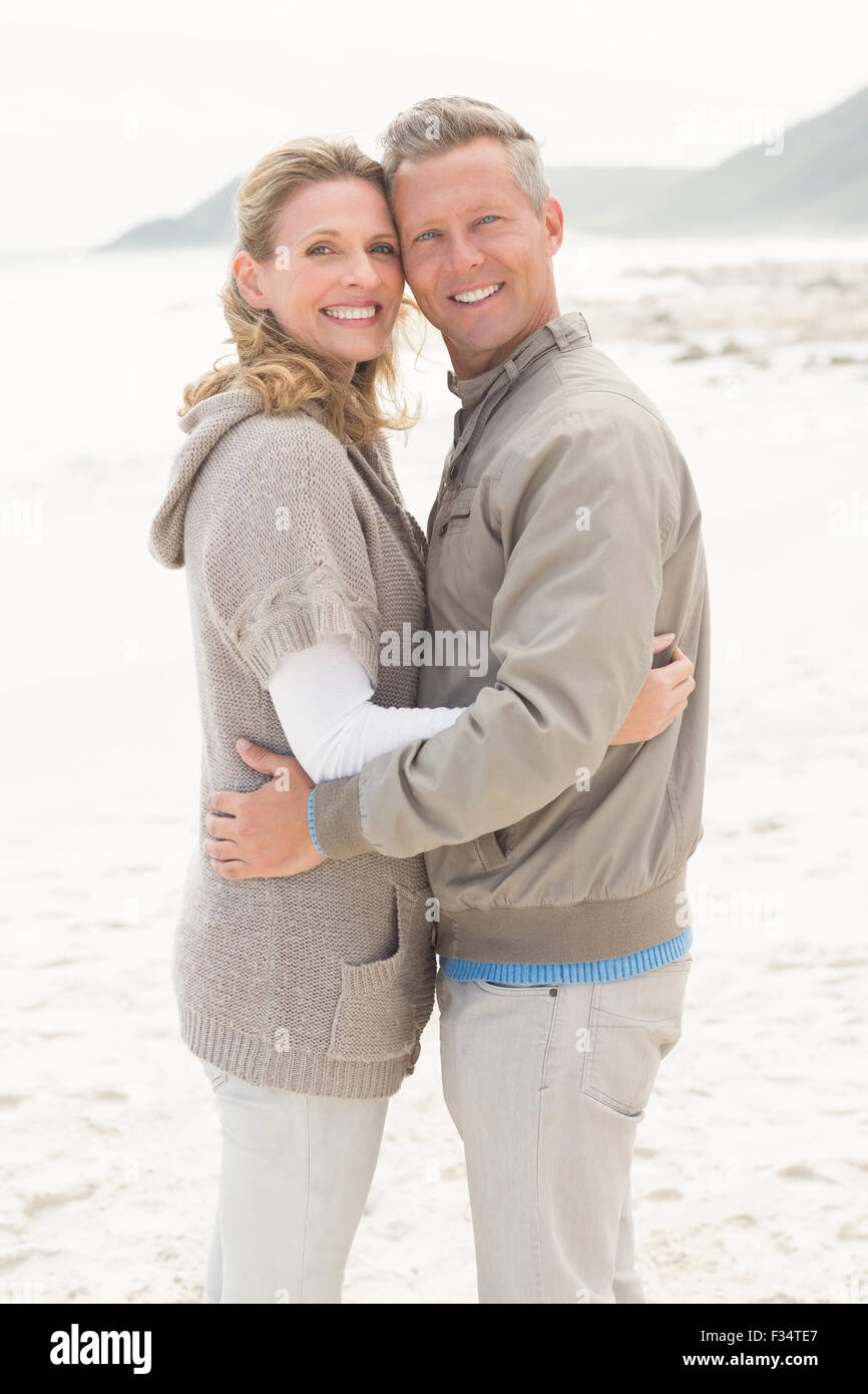 Smiling man holding his partner Stock Photo - Alamy