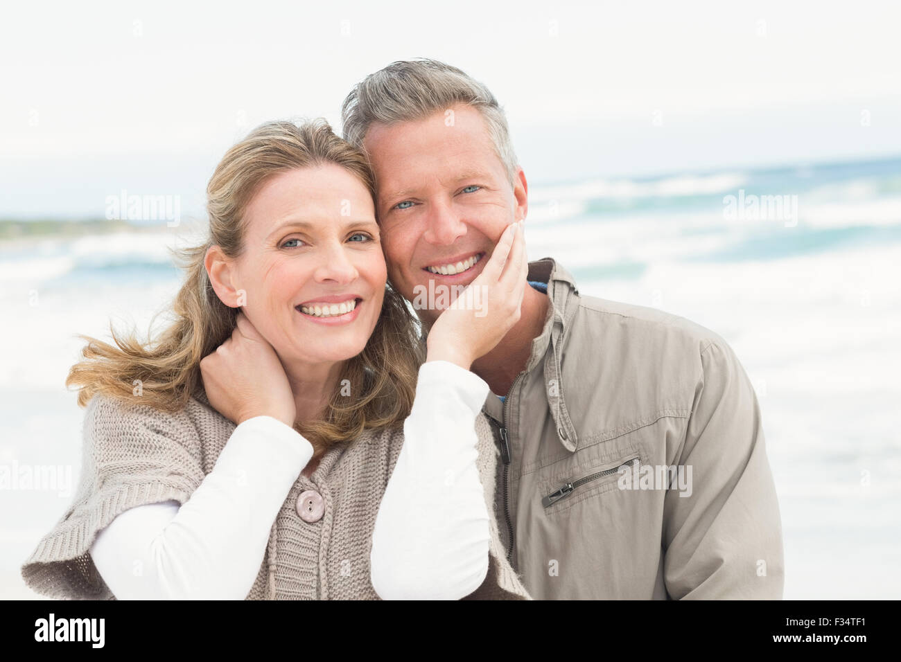 Happy couple standing together Stock Photo - Alamy