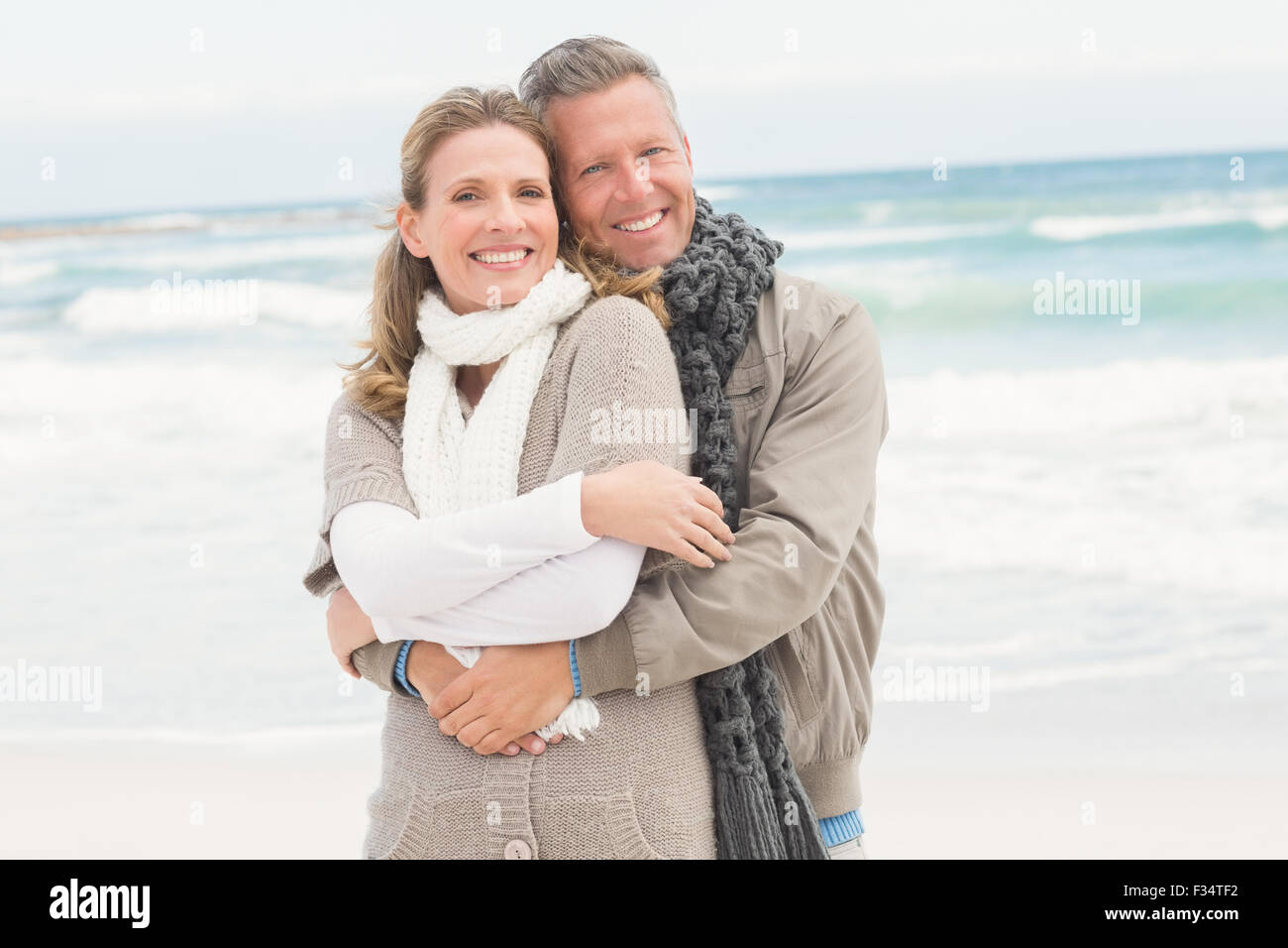 Happy couple standing together Stock Photo - Alamy
