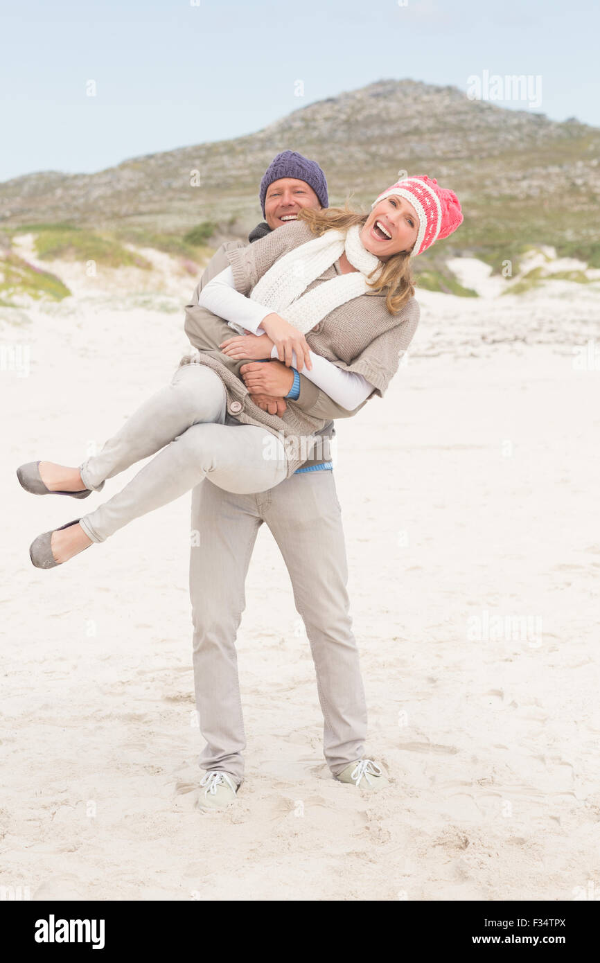 Happy man holding his partner up Stock Photo - Alamy