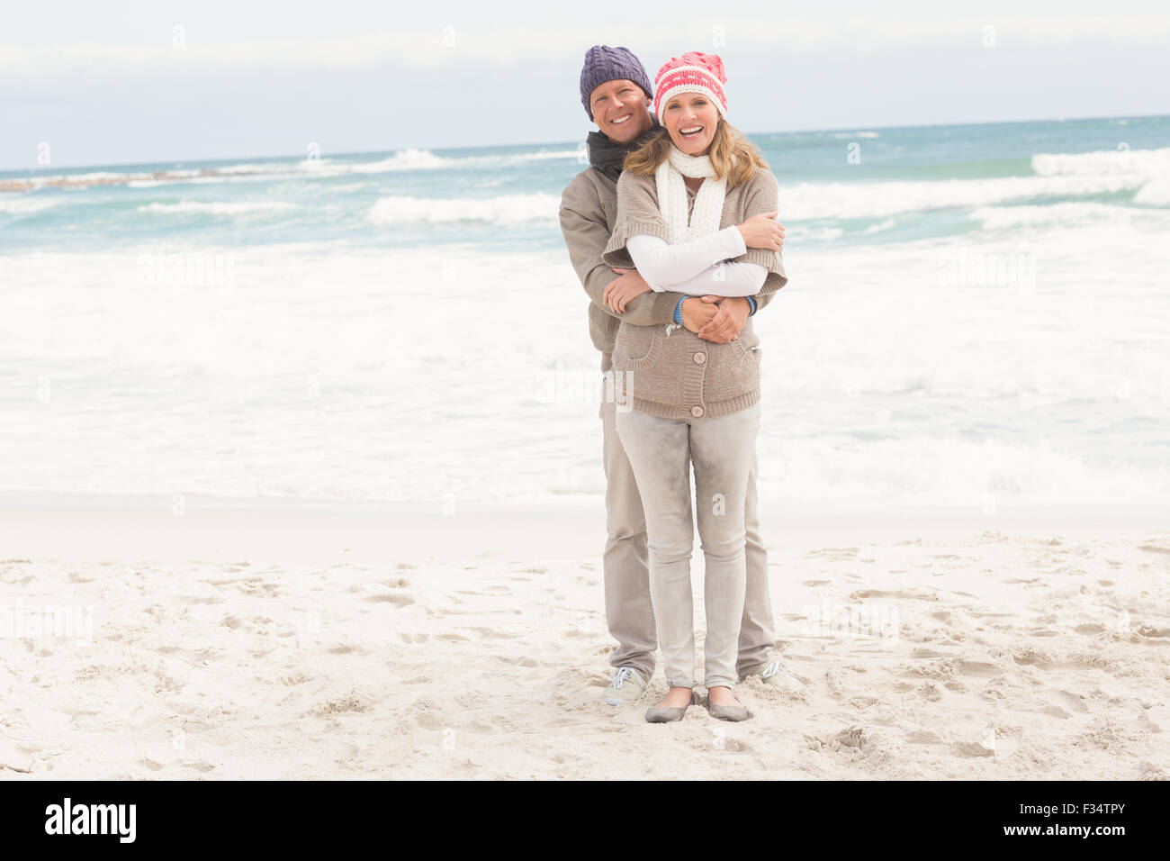 Happy couple holding each other Stock Photo - Alamy