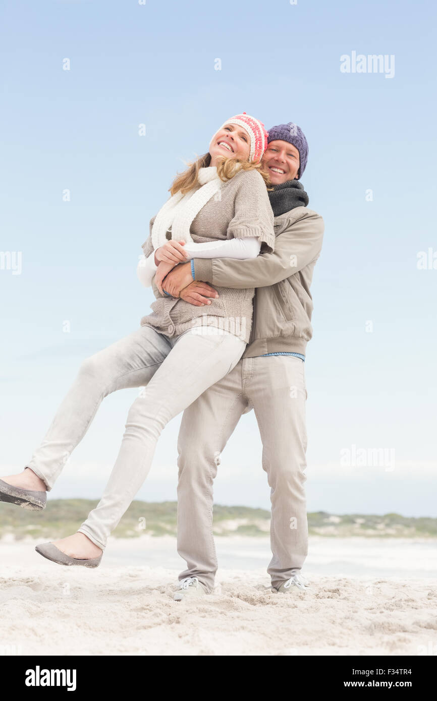 Happy couple holding each other Stock Photo - Alamy