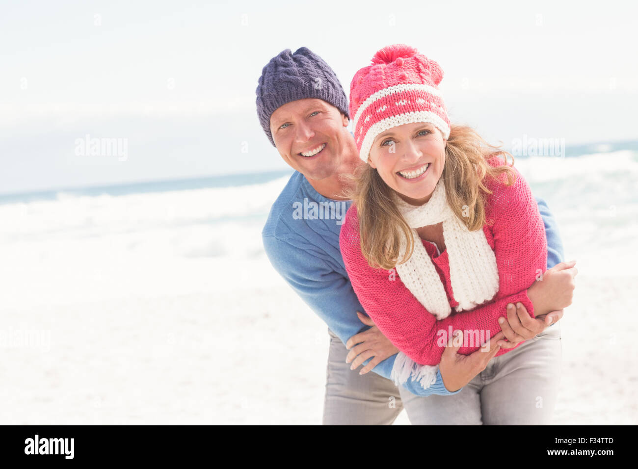 Smiling happy couple hugging each other Stock Photo - Alamy