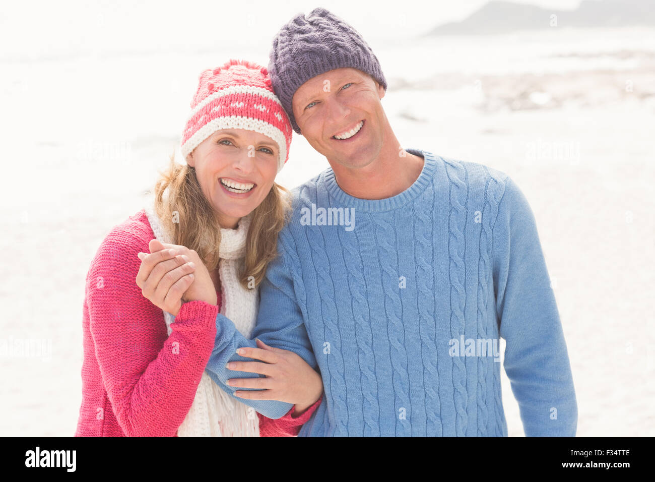 Smiling happy couple hugging each other Stock Photo - Alamy