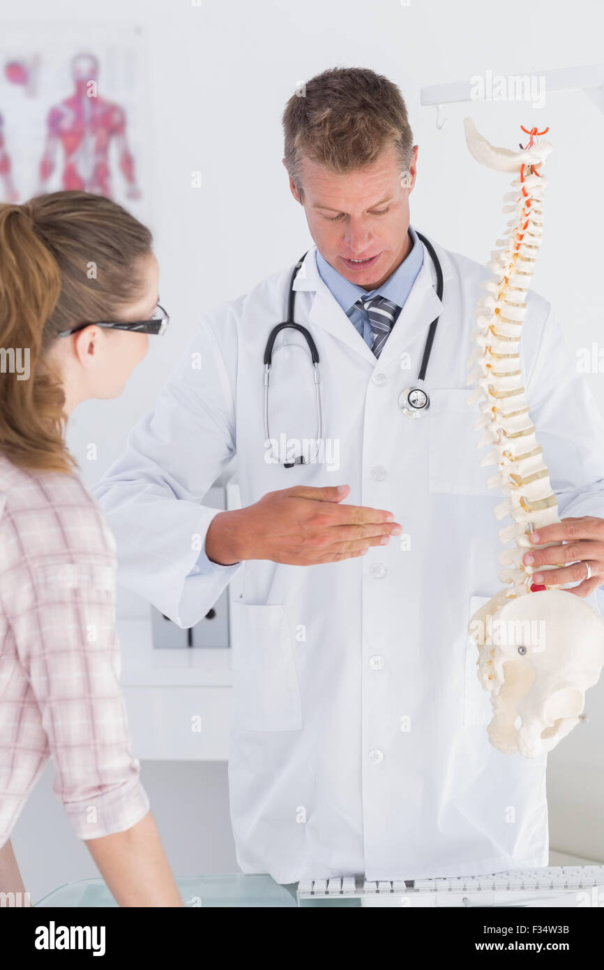 Female doctor explaining spine model hi-res stock photography and ...
