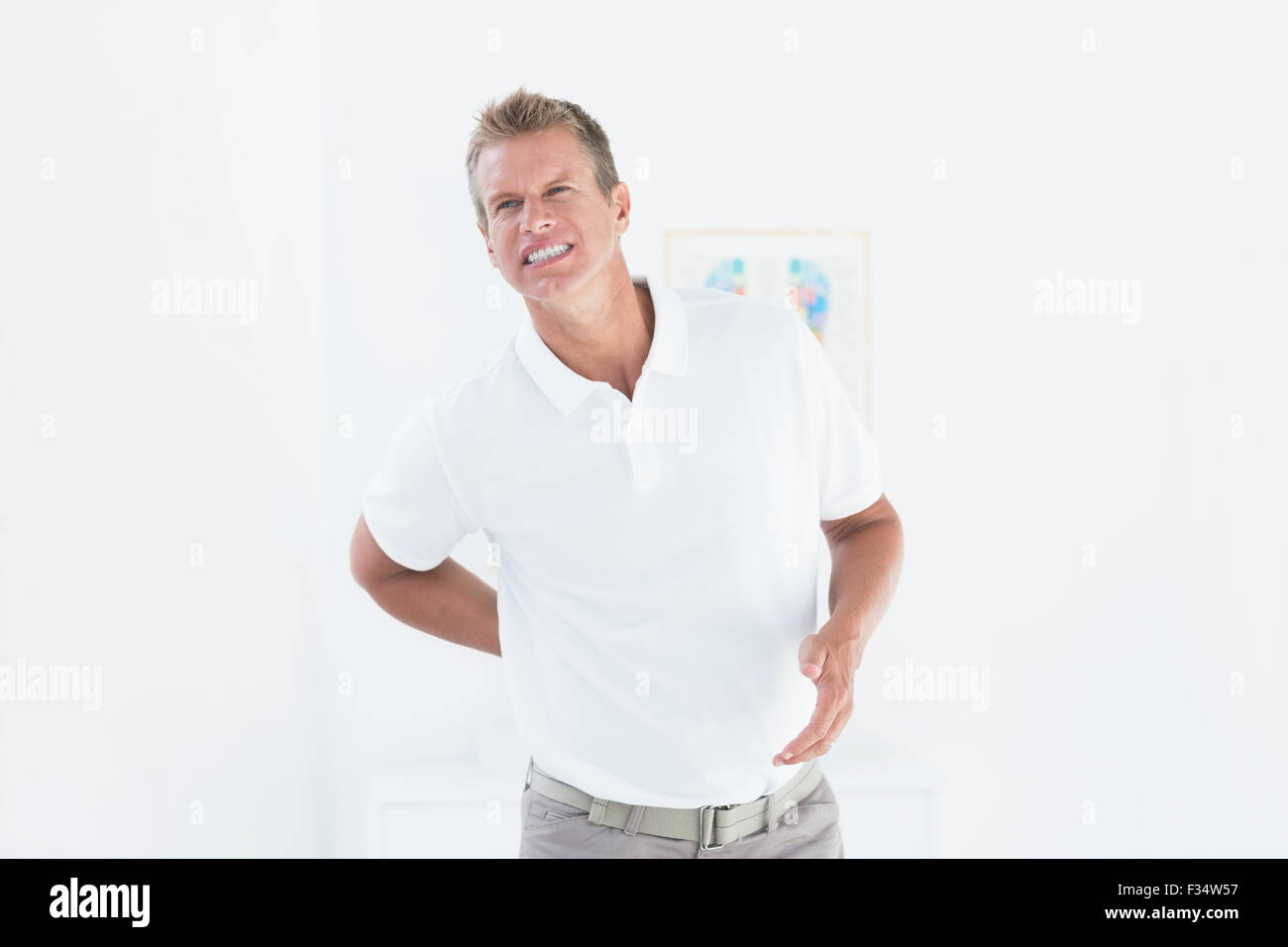 Doctor with back pain Stock Photo - Alamy