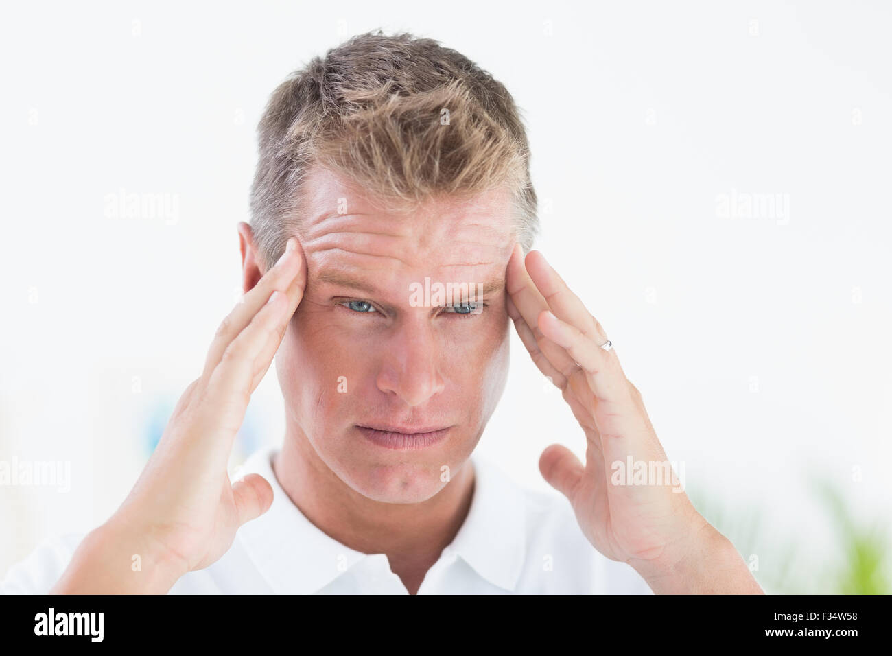 A Doctor with a bad headache Stock Photo - Alamy