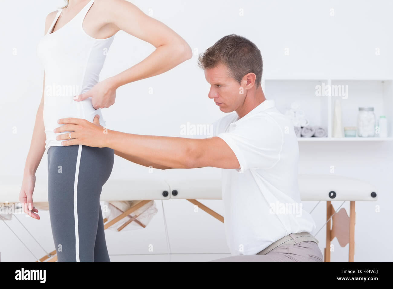 Doctor examining his patient back Stock Photo - Alamy