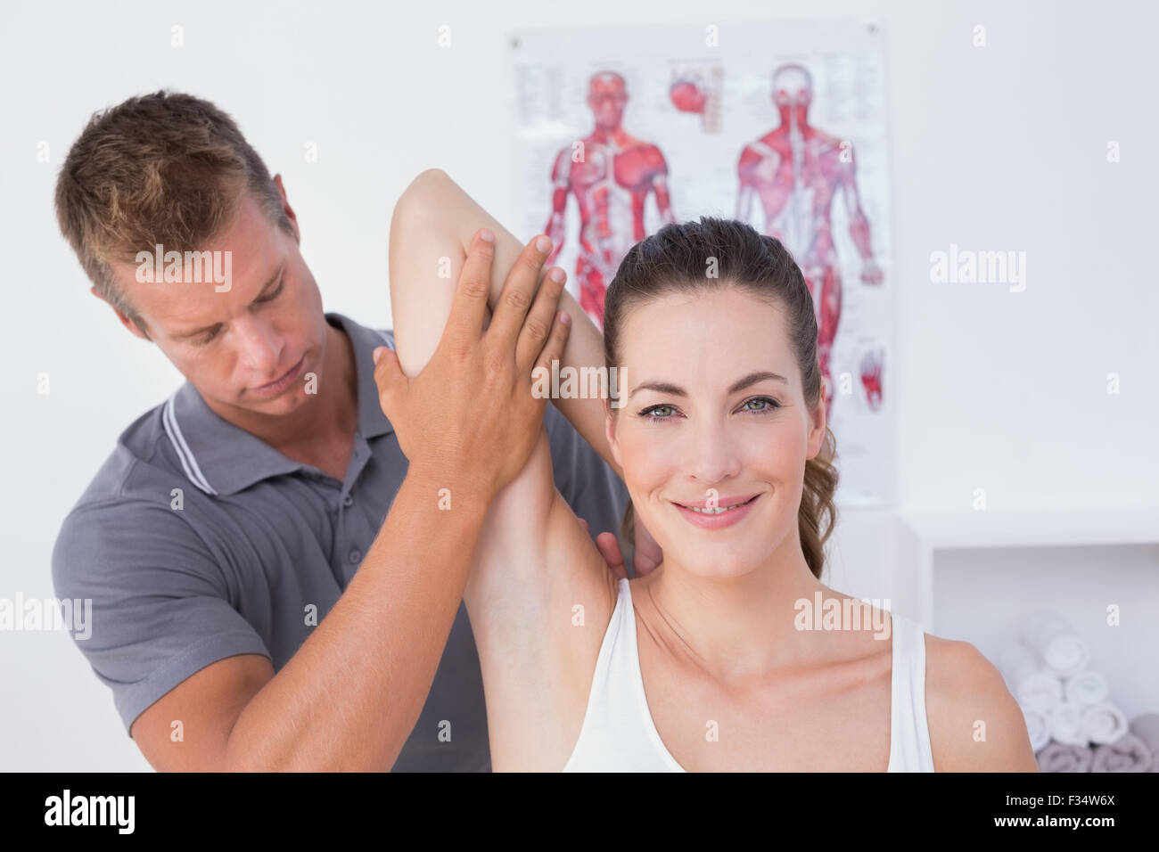 Doctor examining his patient arm Stock Photo - Alamy
