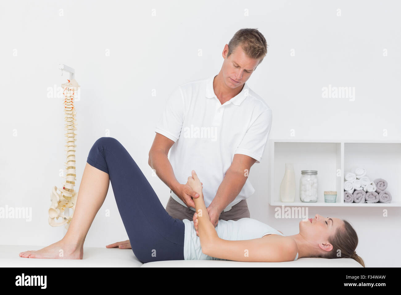 Doctor examining his patient arm Stock Photo - Alamy