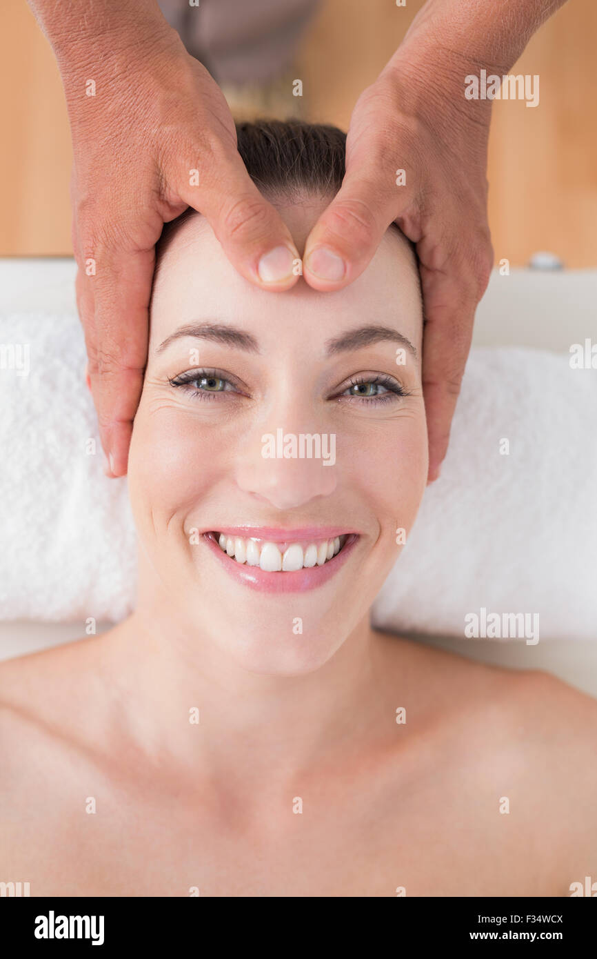 Smiling woman receiving head massage Stock Photo - Alamy