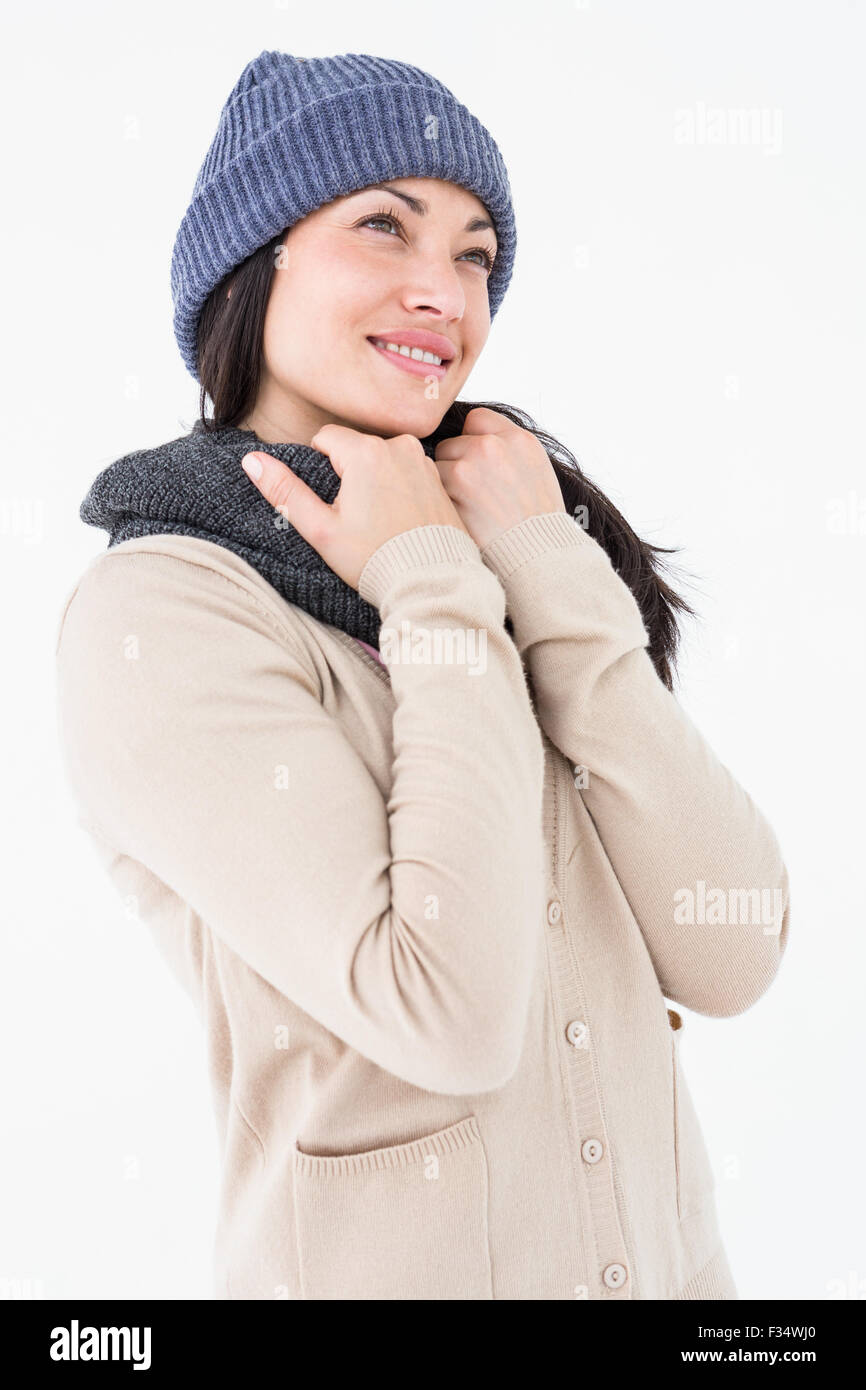 Attractive brunette looking up wearing warm clothes Stock Photo - Alamy