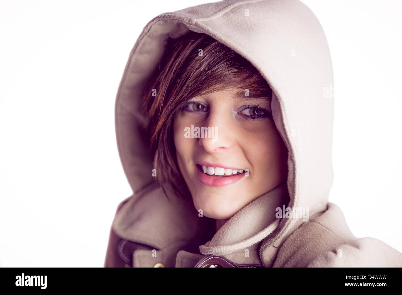 Attractive woman wearing a warm coat with hood raised Stock Photo - Alamy