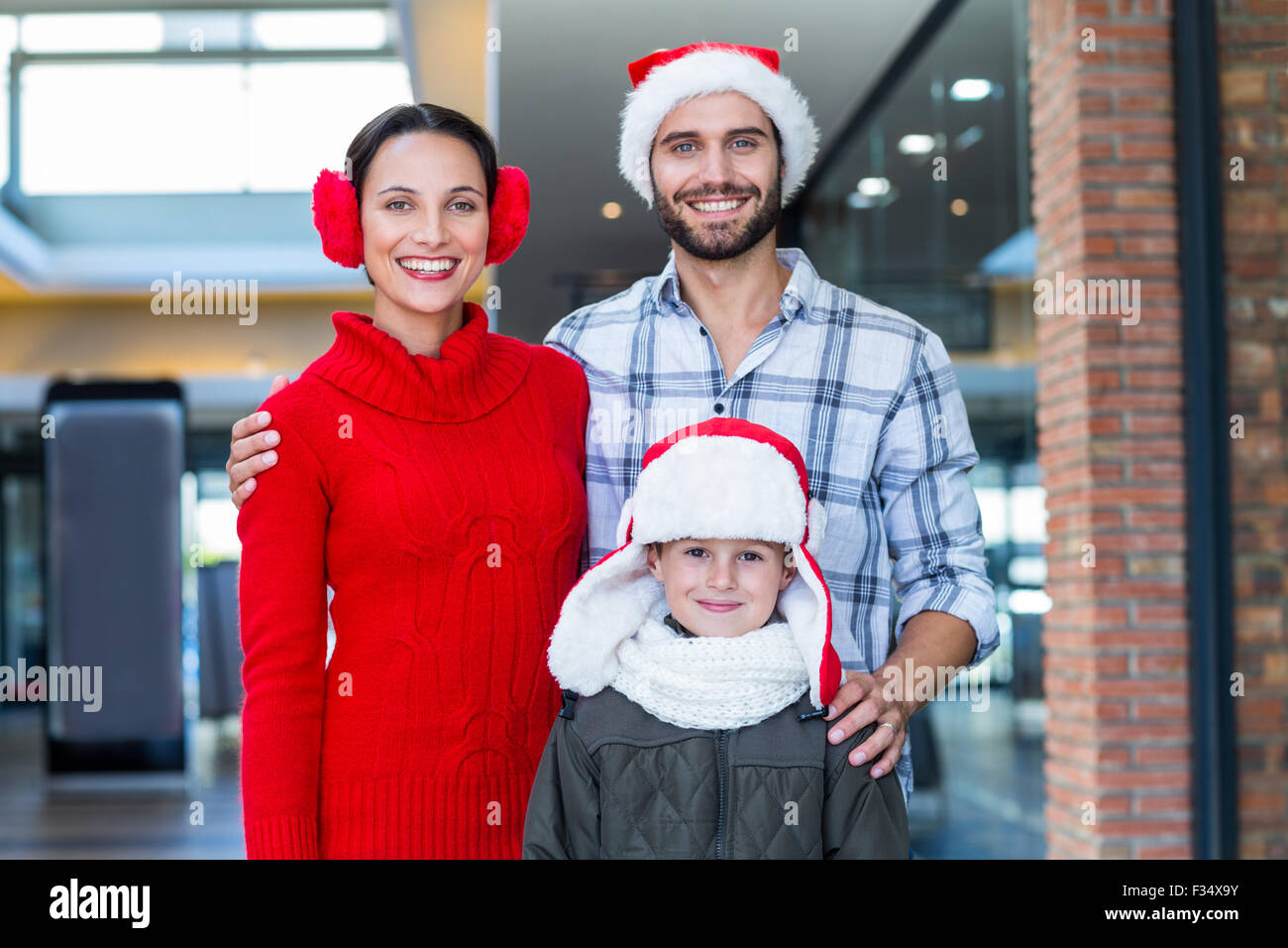 Happy family looking at camera Stock Photo - Alamy
